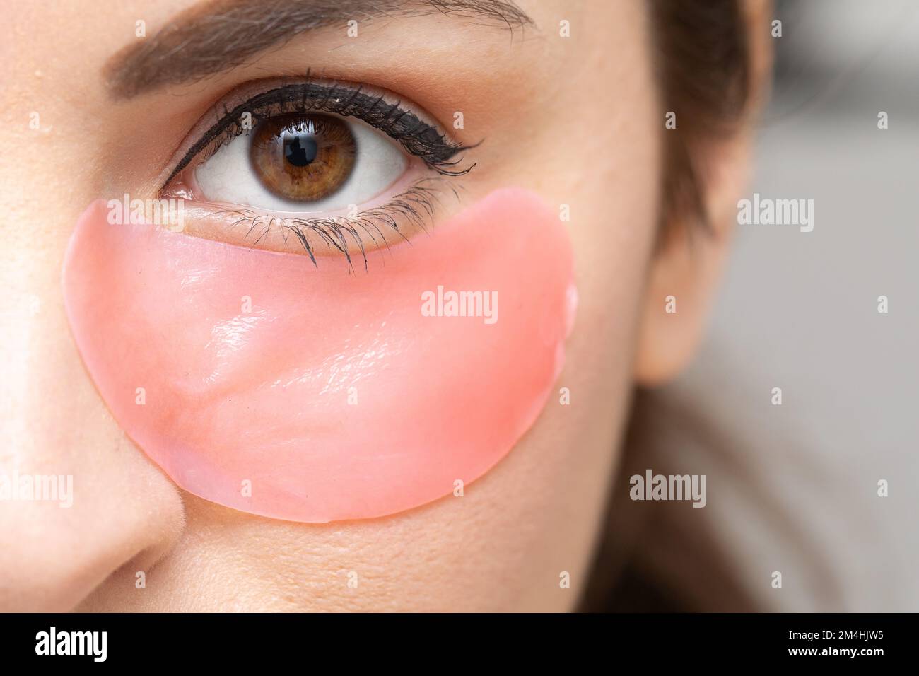 Macro of woman eye with contour mask. Moisturizing patch to eliminate ...