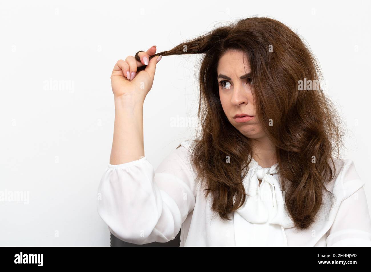 Young woman suffering from trichotillomania, a compulsive psychological ...