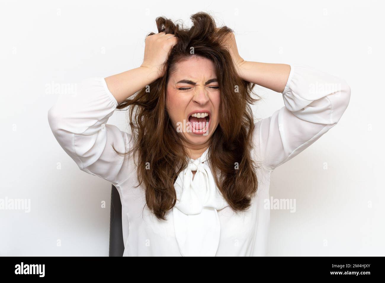 Scene of anger and hysterism of an employee who has a nervous crisis ...