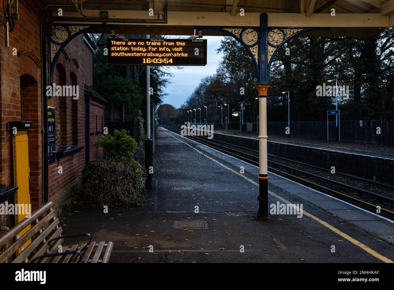 Claygate, UK. 21st Dec, 2022. a deserted platform and a sign announcing ...