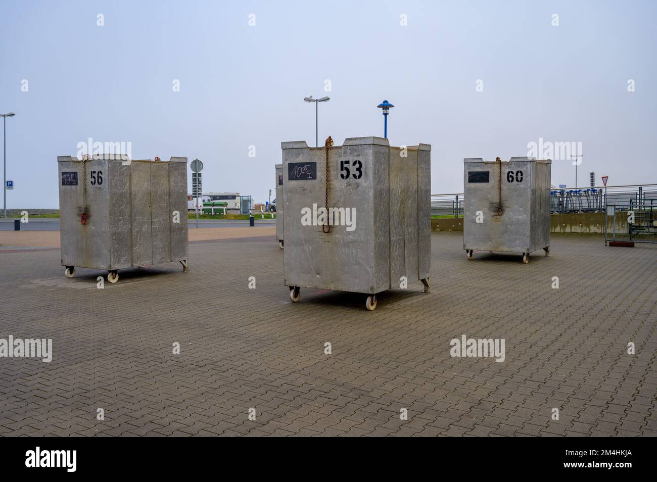 Numbered cargo containers for loading by crane onto a ferry arranged in ...