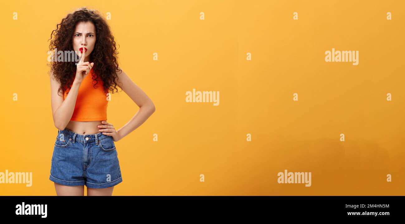 Sister displeased sibling saying cursing words standing serious and ...