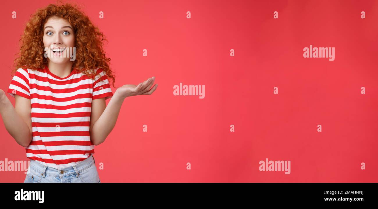 Unaware carefree clueless attractive redhead woman curly hairstyle ...