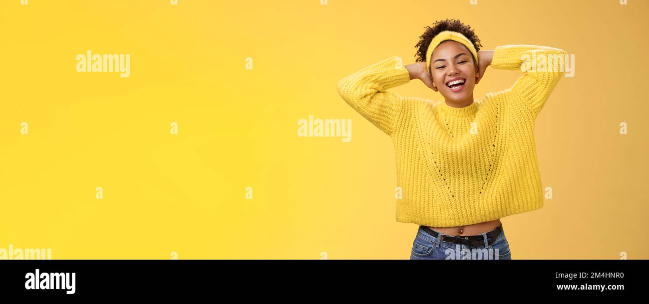 Carefree joyful lucky african-american female student in sweater ...