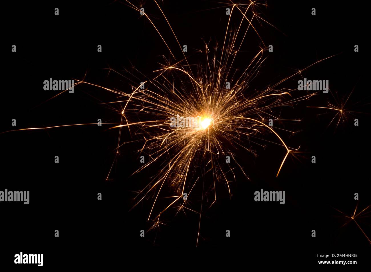 New years eve celebration with sparkling fireworks.Sparklers on a black ...