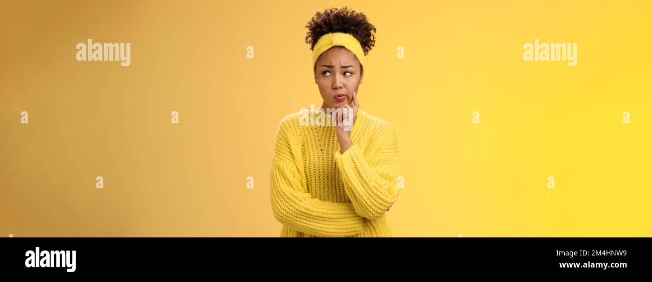 Perplexed unsure cute timid african-american female thinking how escape ...