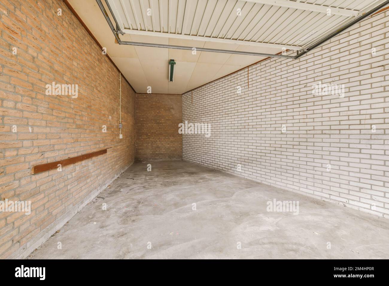 an empty room with white bricks on the wall and ceiling above it, there ...