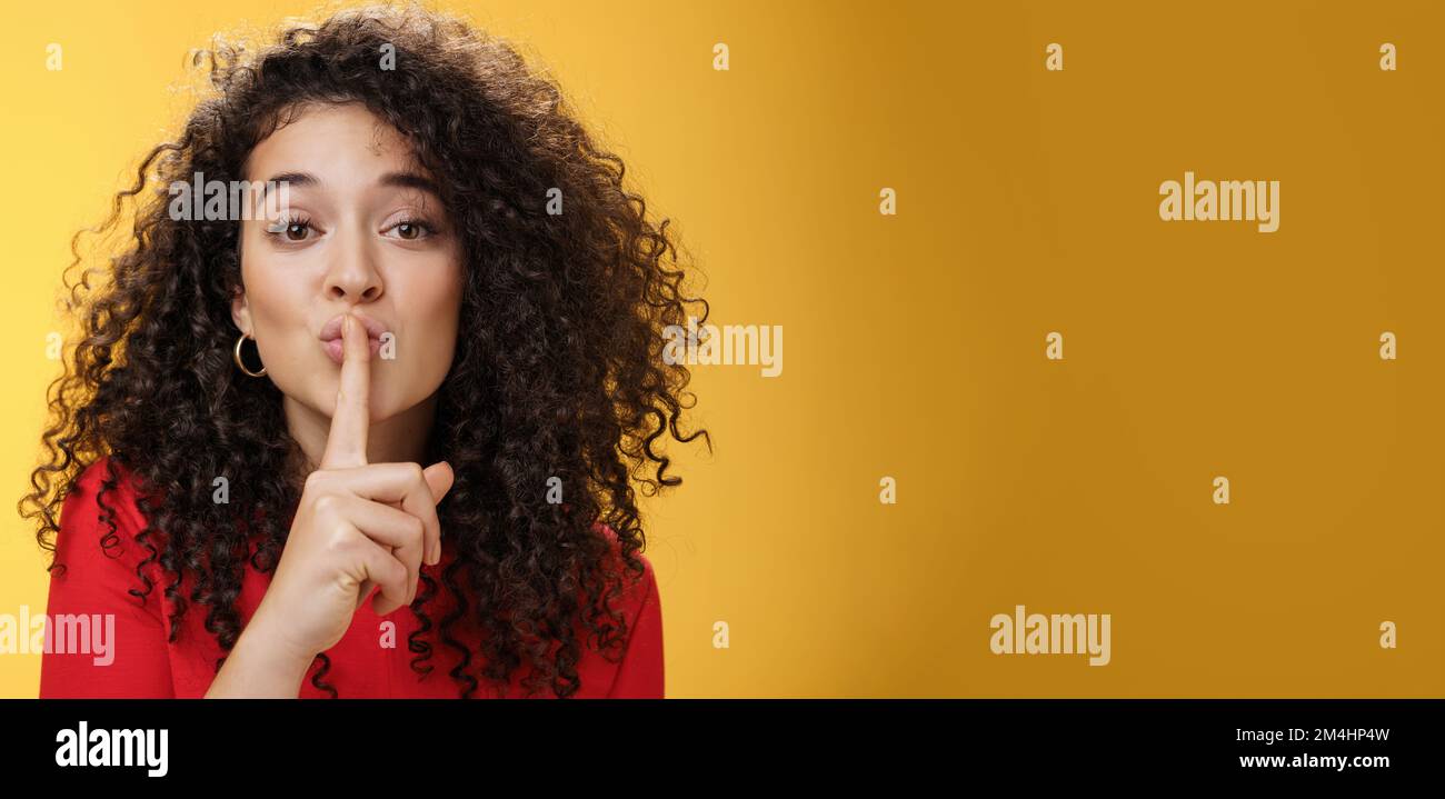 Shh please not tell secret. Cute and tender woman with curly hairstyle ...