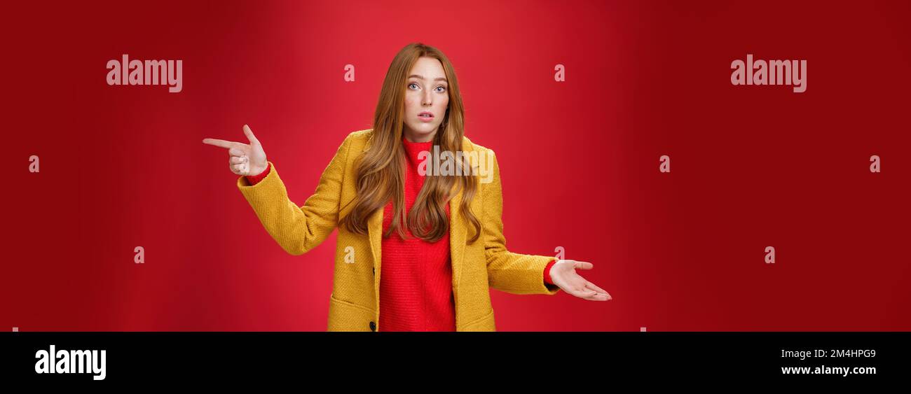 Woman missed client posing confused and unaware how happened shrugging ...