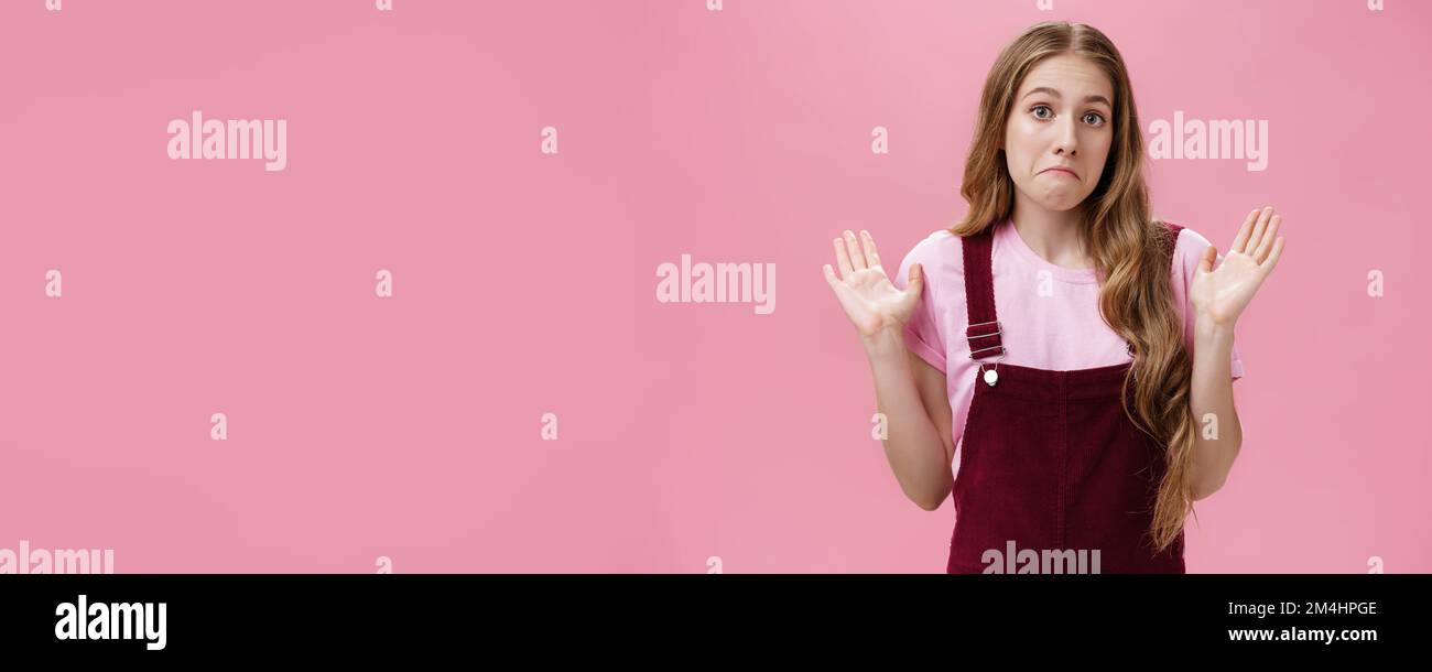 I am not involved. Portrait of unaware and clueless innocent cute woman ...