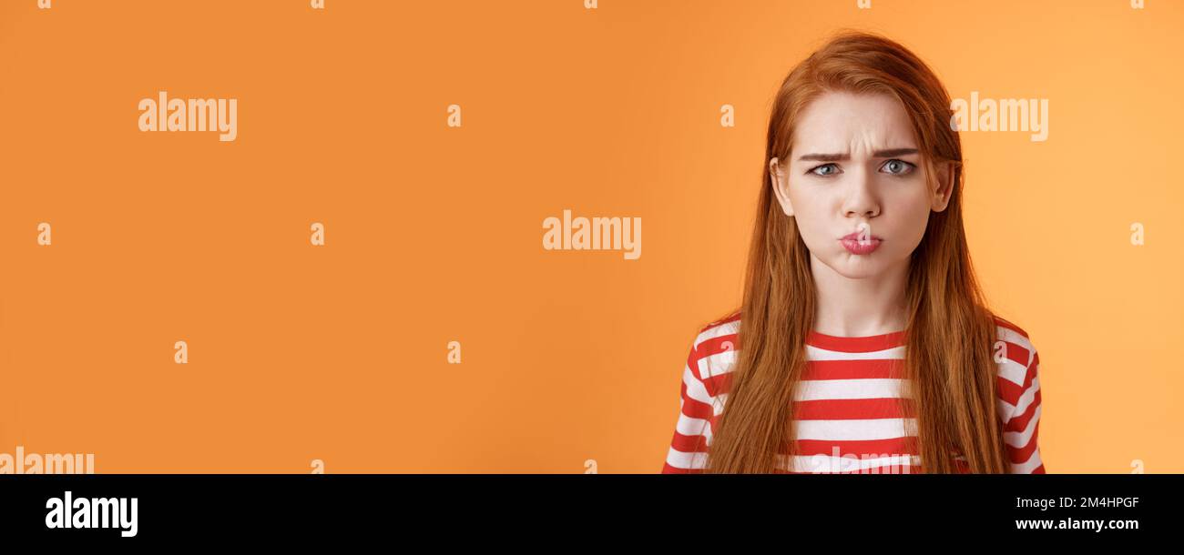 Childish offended cute redhead girl pouting, sulking upset, frowning ...