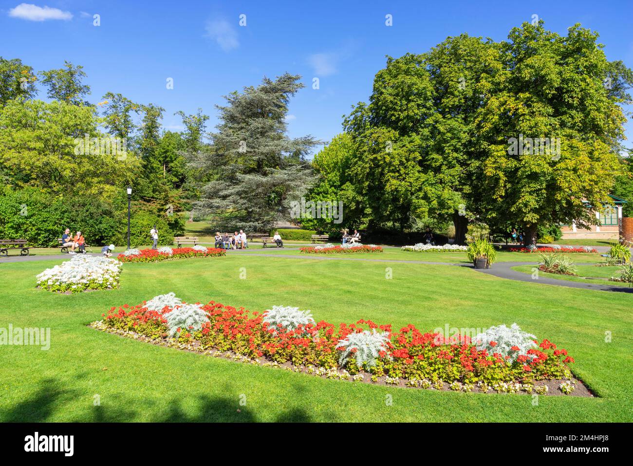 Harrogate Yorkshire People walking around Ornamental flower beds in the ...