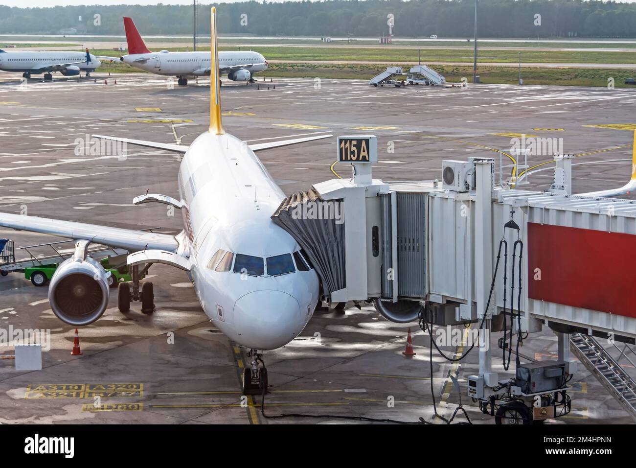 Airplane is docked with gangway to gate of terminal airport Stock Photo ...
