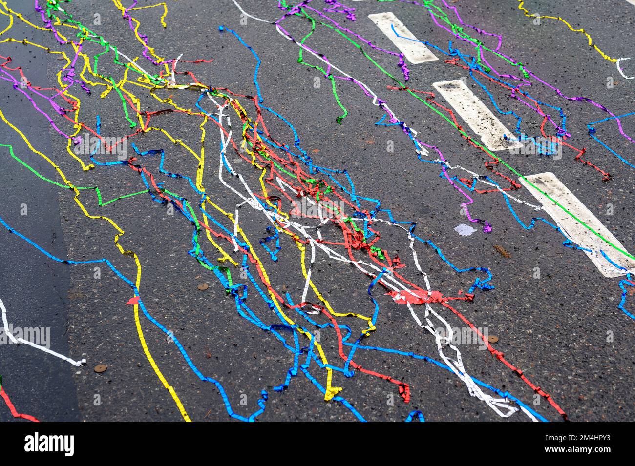 Colorful streamers on a street on New Year's morning Stock Photo - Alamy