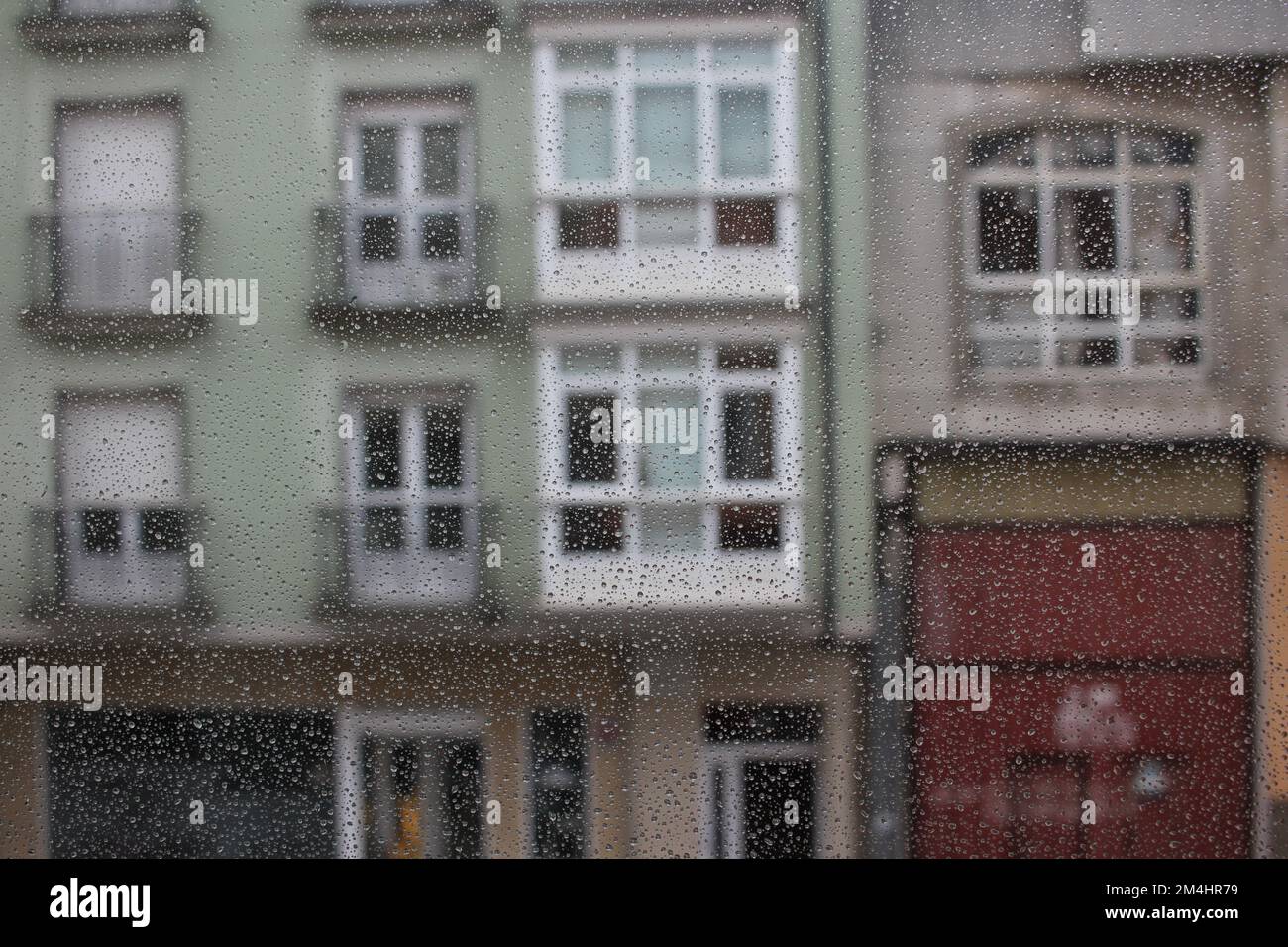 rainy day in the city and drops of water in the windows Stock Photo - Alamy