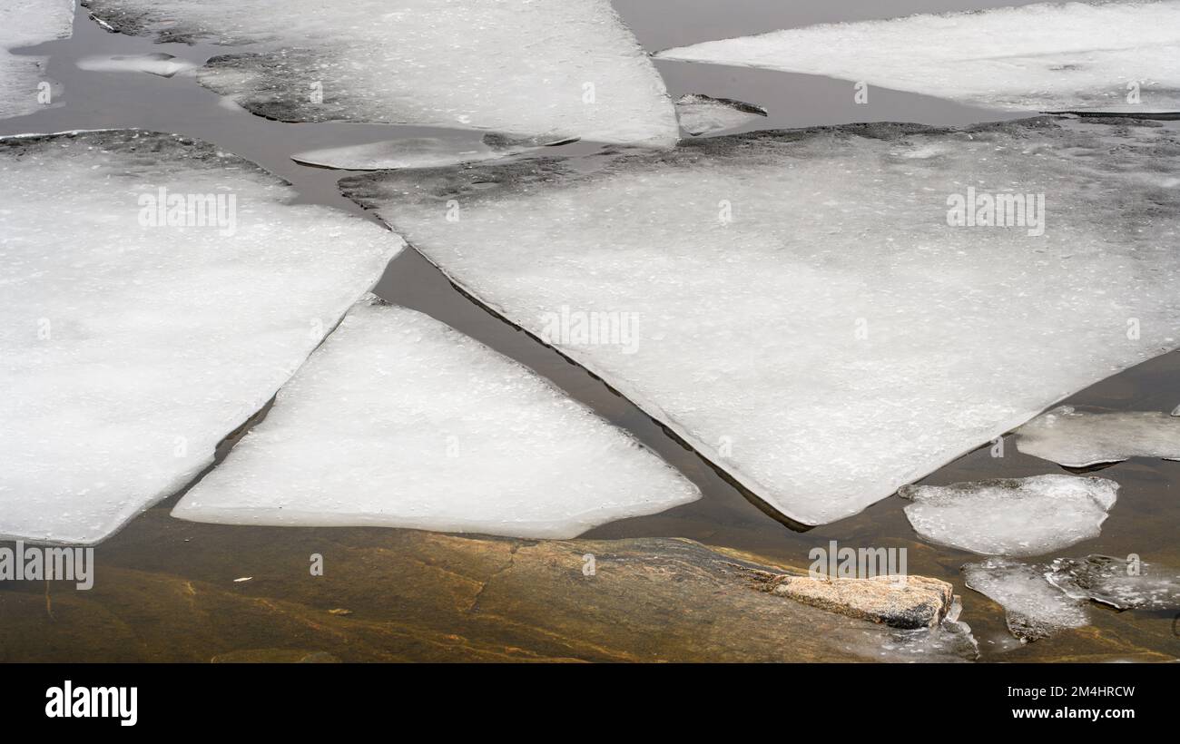 Melting ice, shoreline granite rock on Georgian Bay in early spring ...