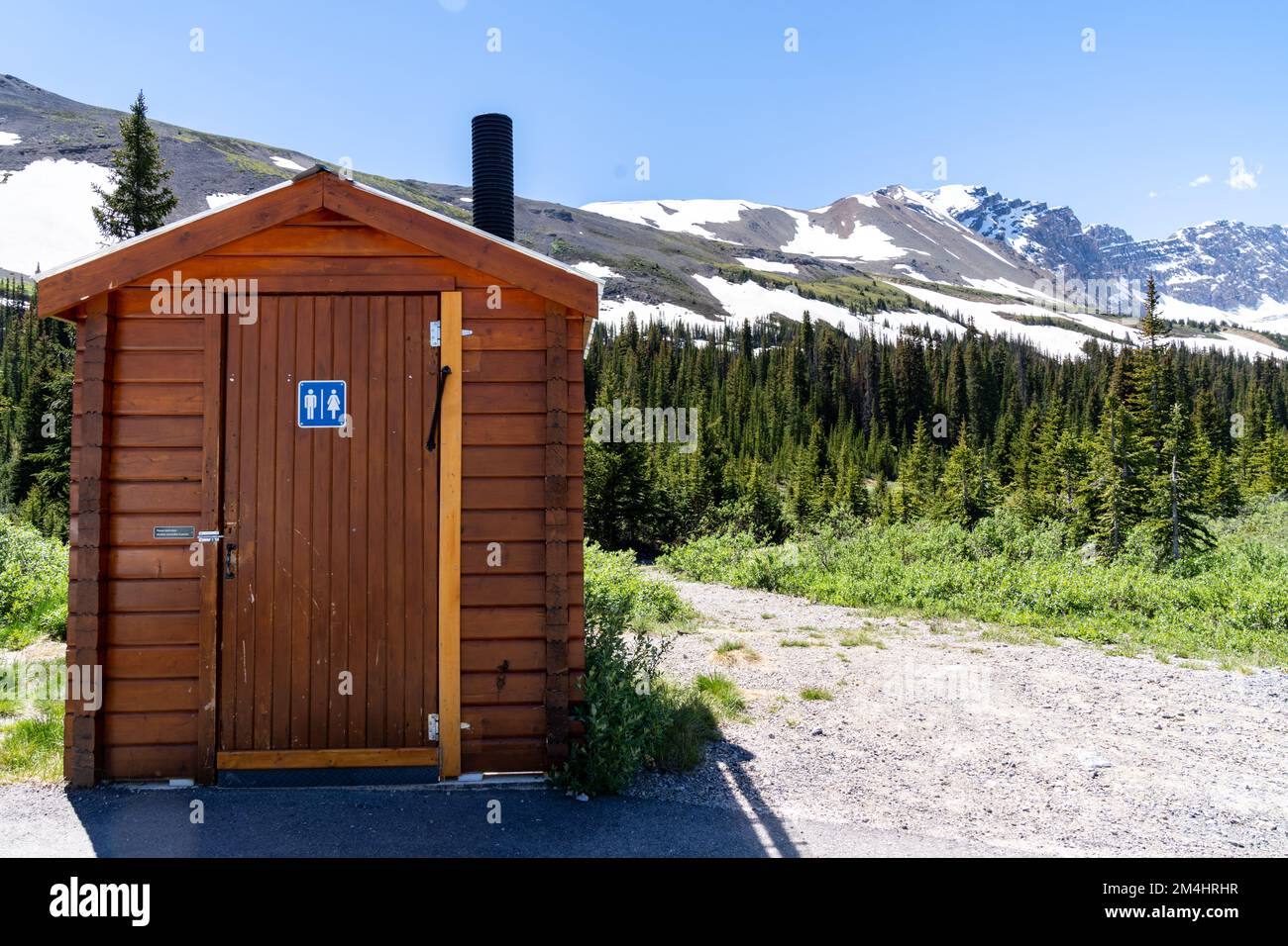 Rustic pit toilet in the Canadian Rockies along the Icefields Parkway ...