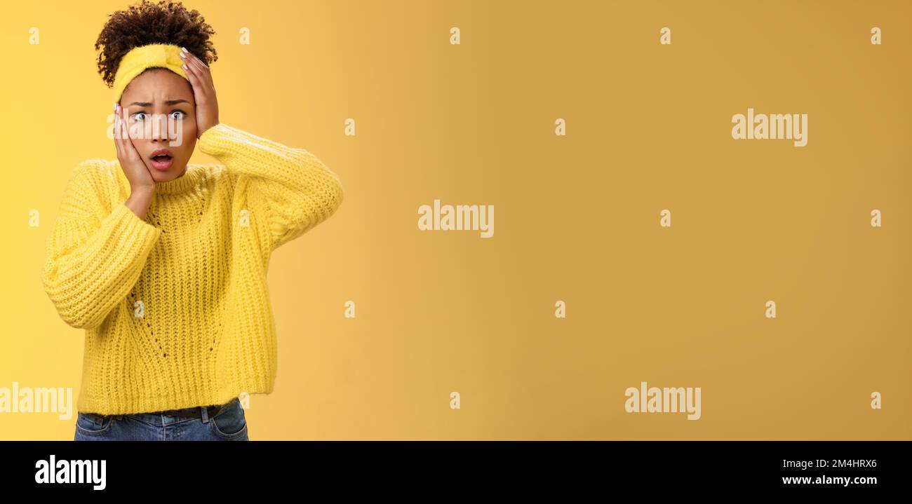 Shocked terrified timid insecure young stylish african-american woman ...