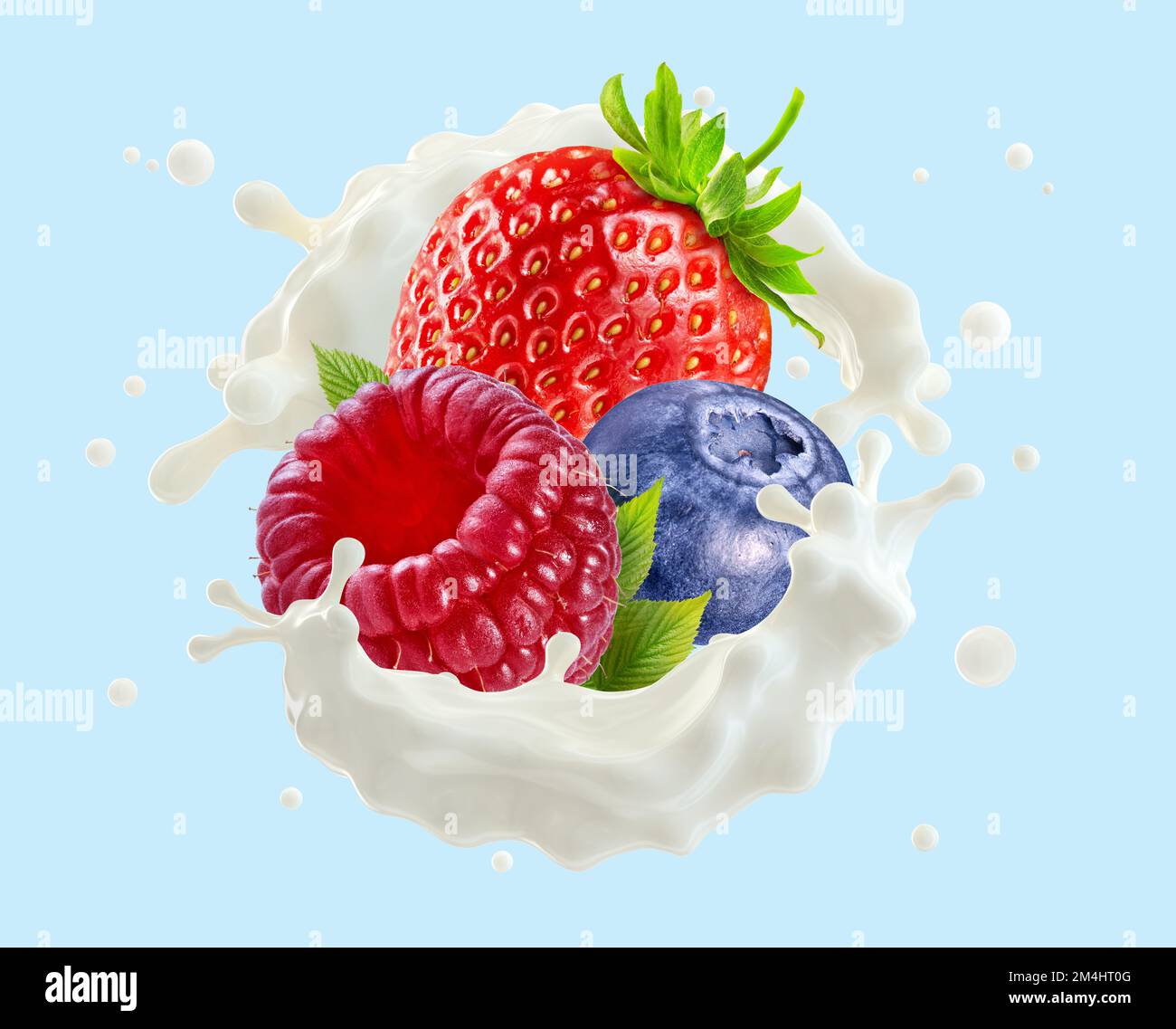 Fresh milk or yogurt splash with ripe strawberry, blueberry, raspberry ...