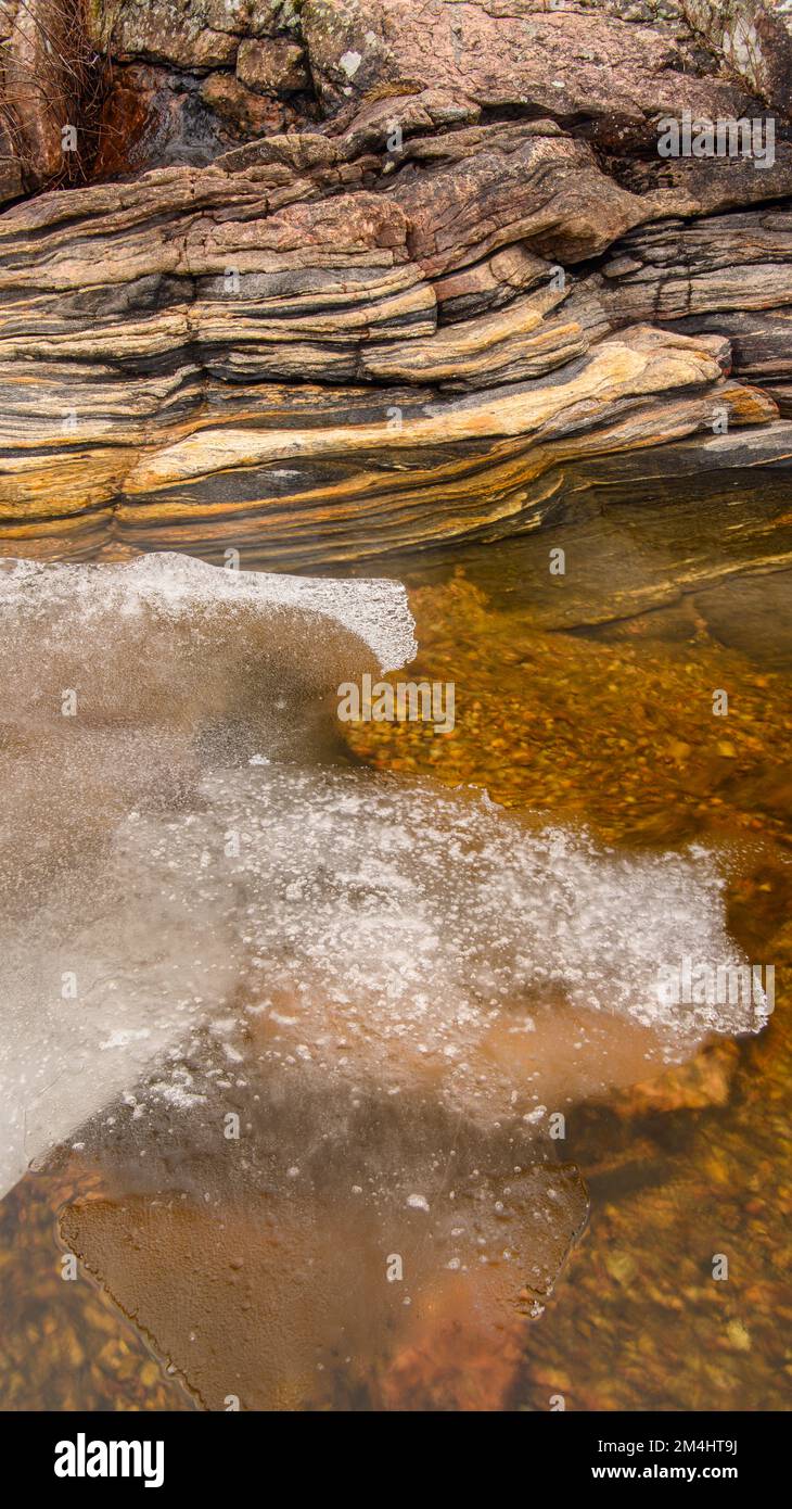 Melting ice, shoreline granite rock on Georgian Bay in early spring ...