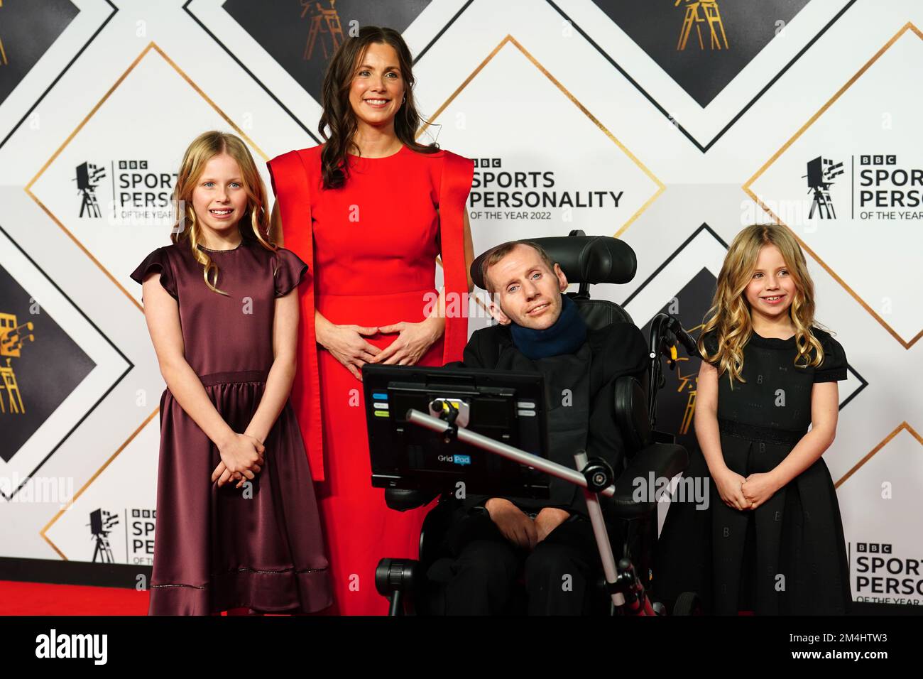 Rob Burrow poses on the red carpet with wife Lindsey and daughters ...