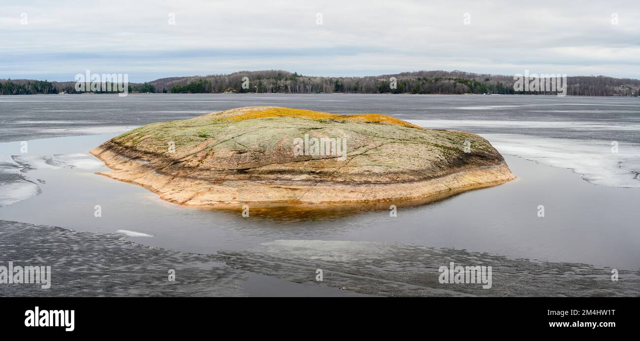 A small rock island in Georgian Bay, melting ice in early spring, Parry ...