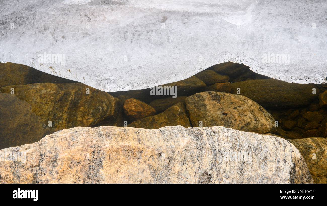 Melting ice, shoreline granite rock on Georgian Bay in early spring ...