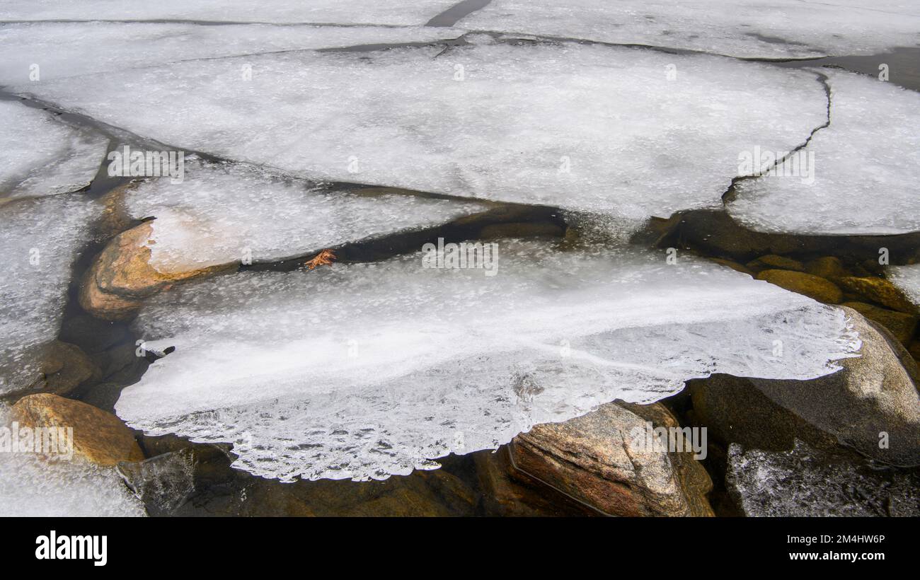Melting ice, shoreline granite rock on Georgian Bay in early spring ...