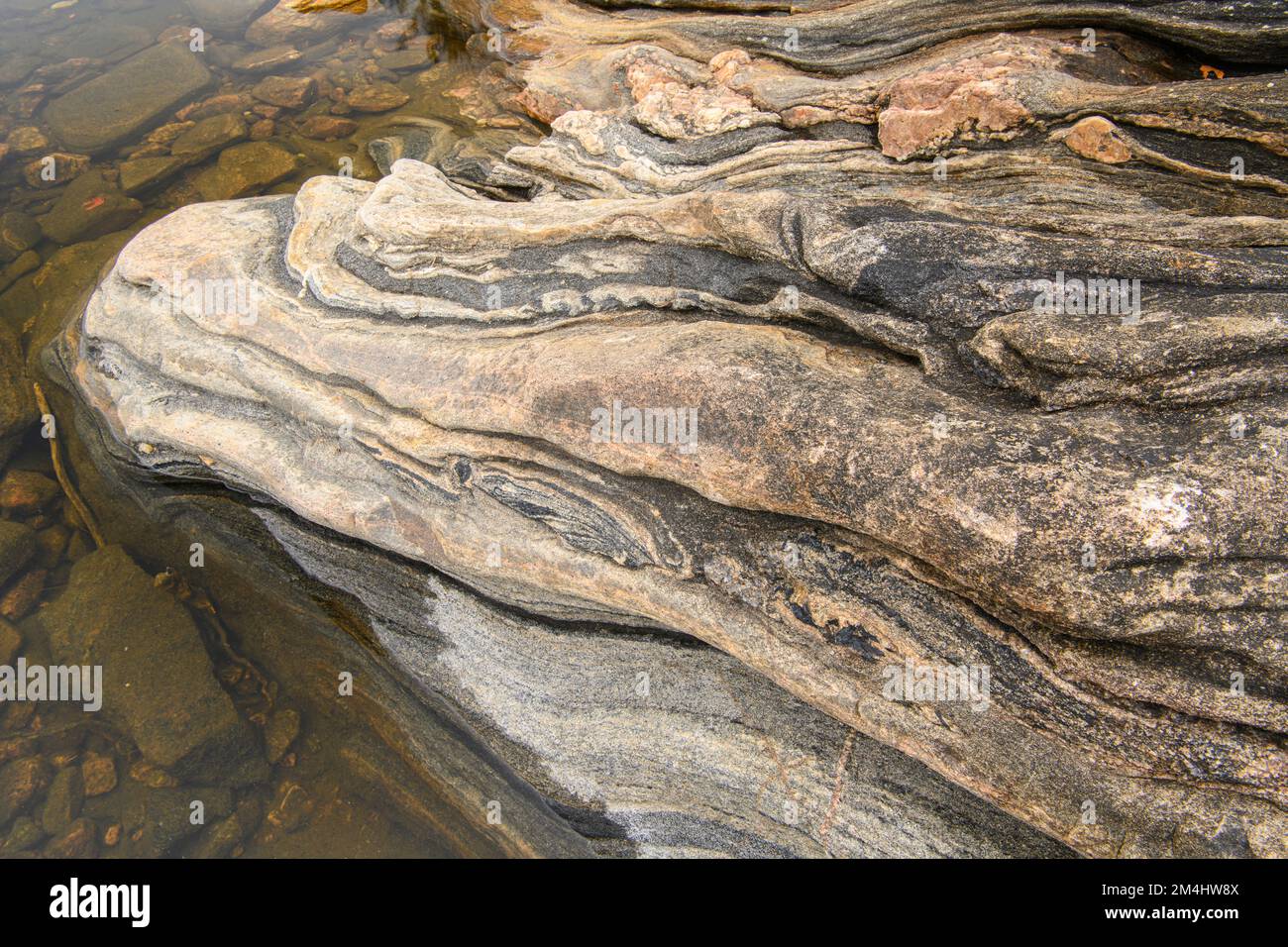 Melting ice, shoreline granite rock on Georgian Bay in early spring ...