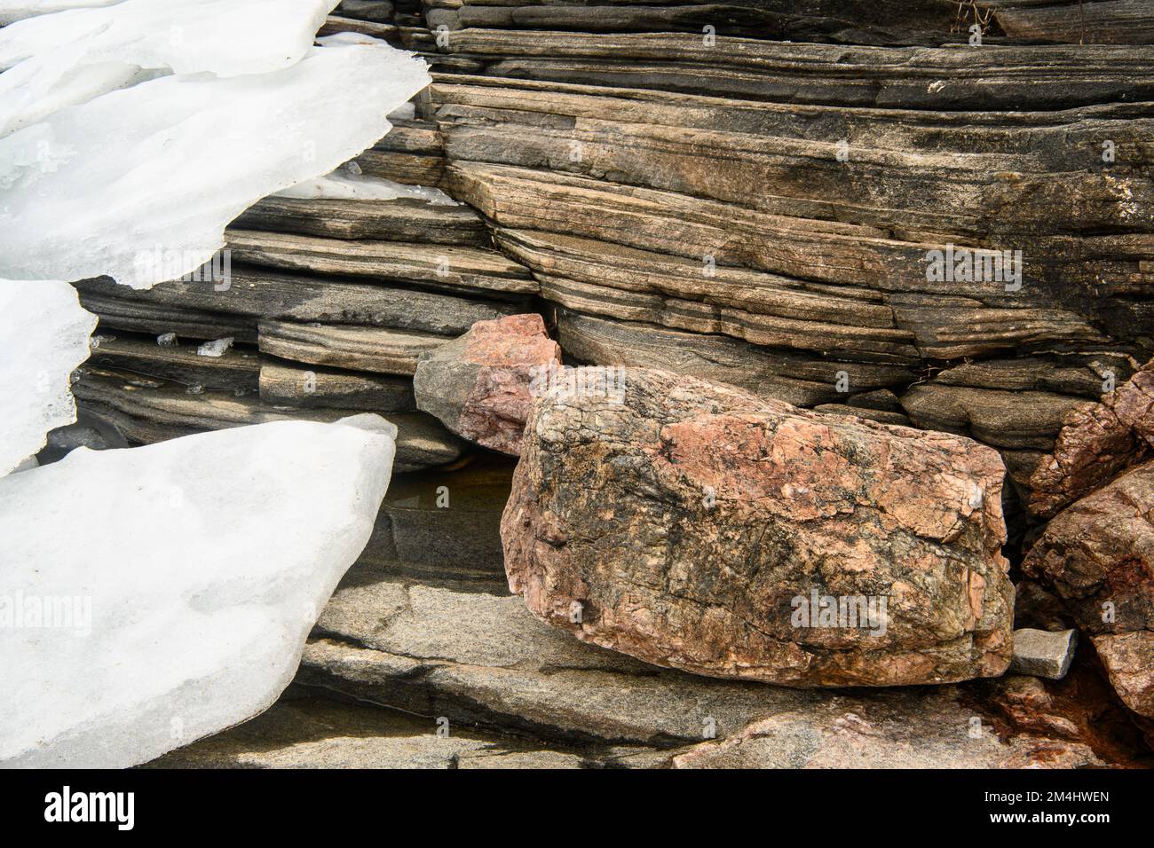 Melting ice, shoreline granite rock on Georgian Bay in early spring ...