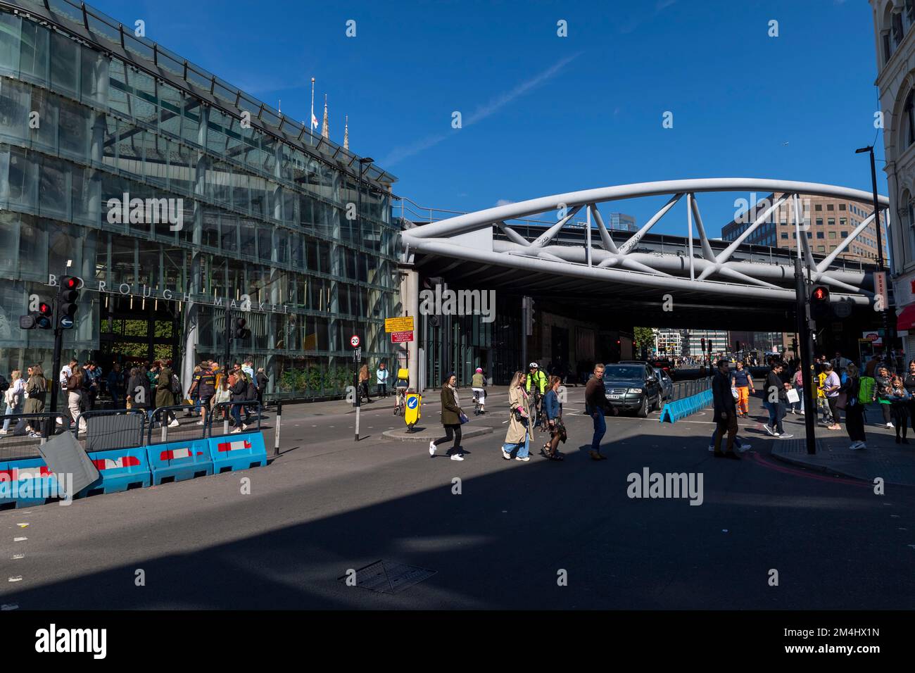 A view looking north of pedestrians crossing Borough High Street, with ...