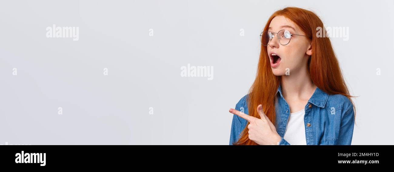 Cool take a look. Close-up portrait fascinated and excited cute redhead ...