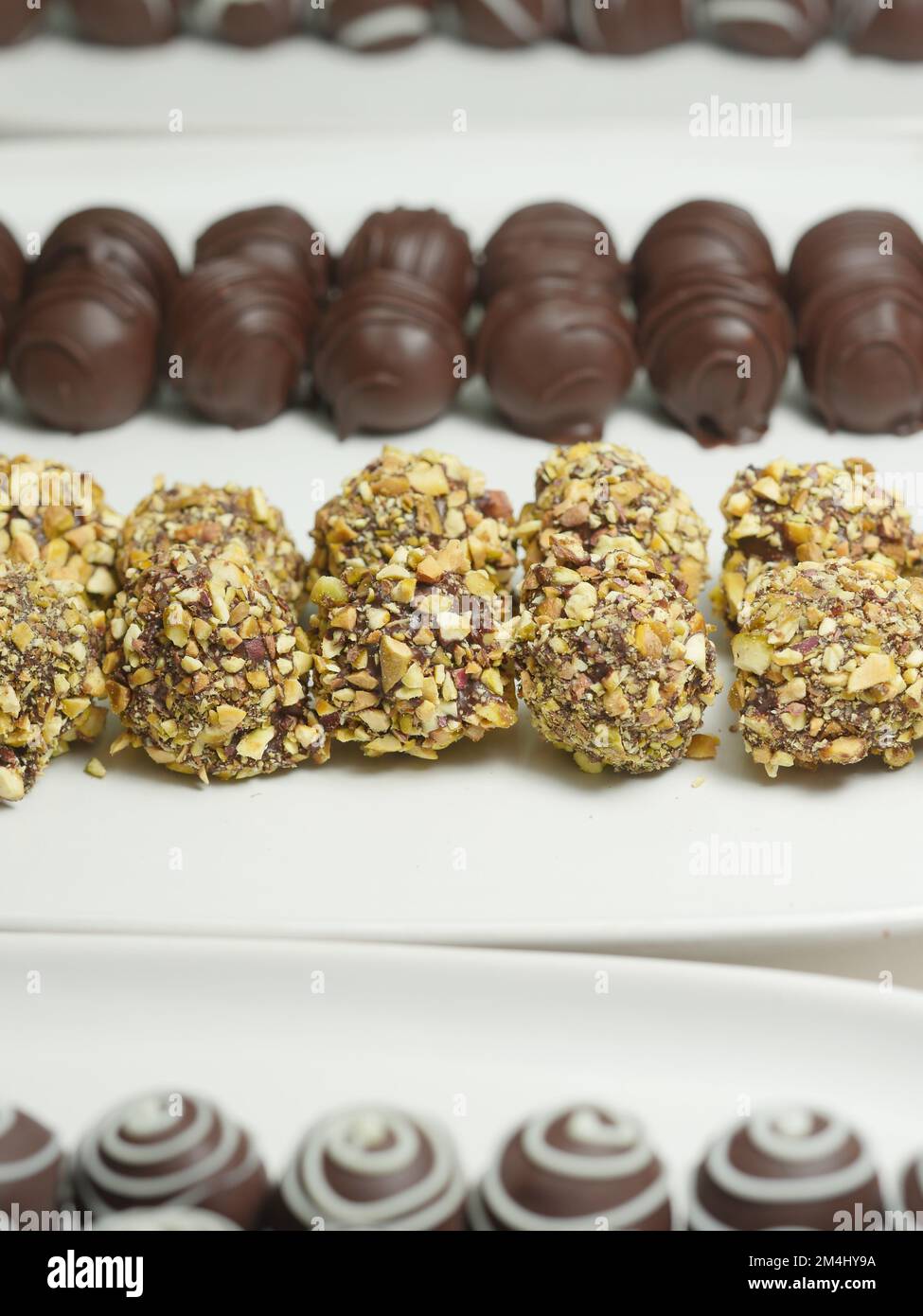 handmade pralines from chocolate on display Stock Photo - Alamy