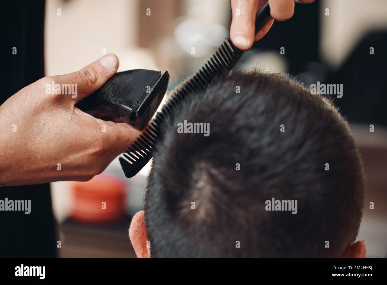 Barber shaving caucasian man in barber shop Stock Photo - Alamy