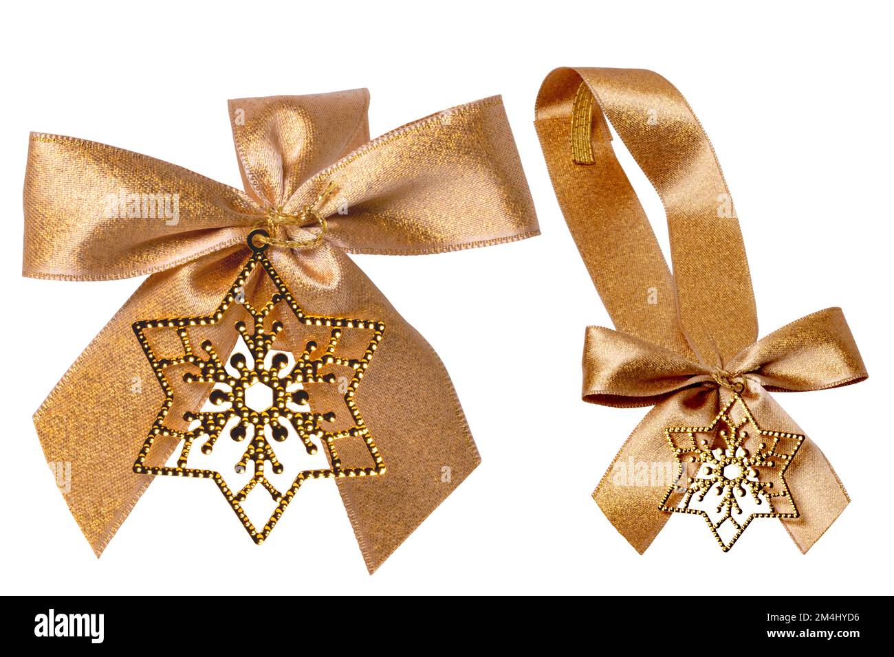 Gift bows. Closeup of a decorative golden ribbon bow made of silk for ...