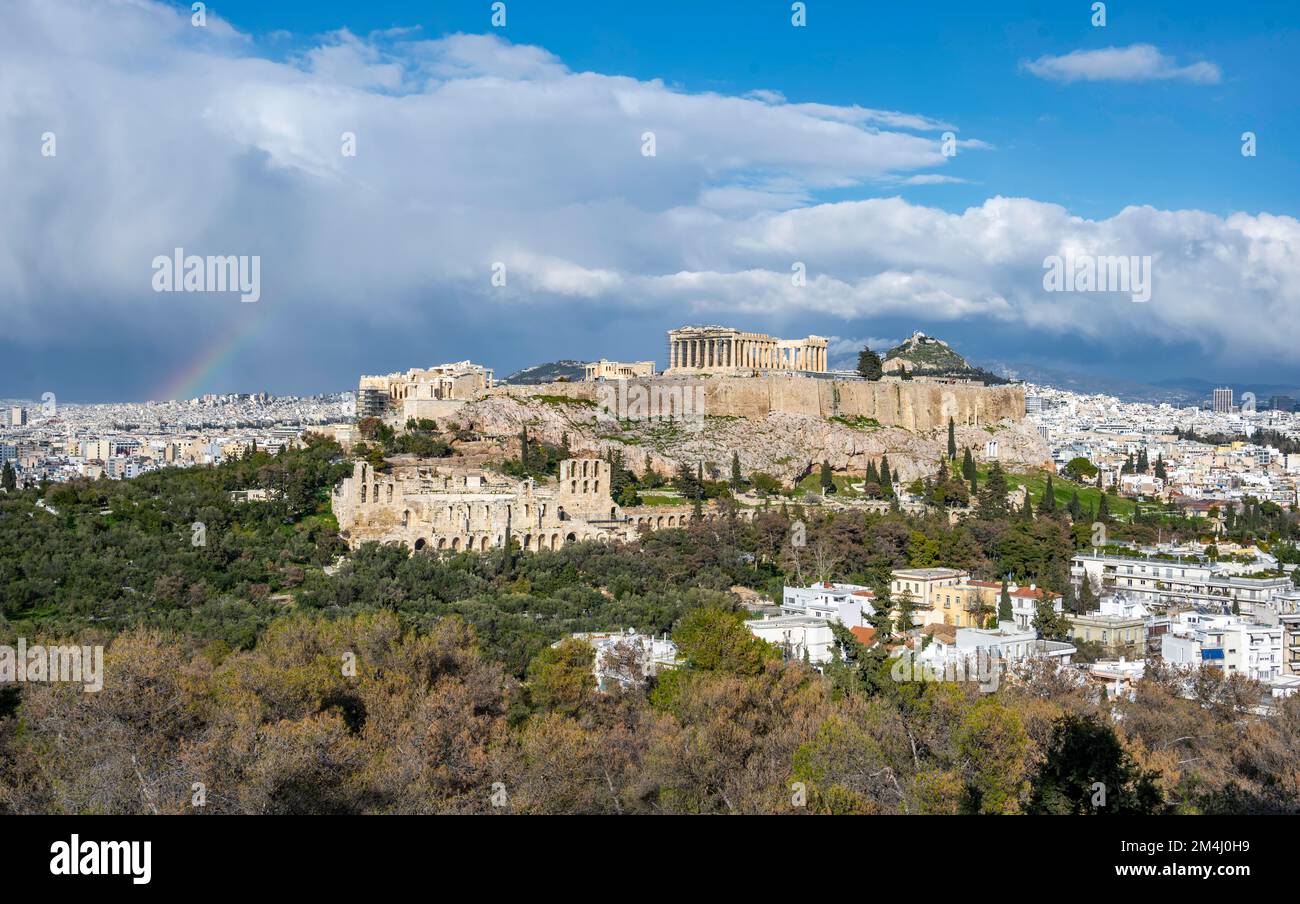 View from Philopappos Hill over the city with rainbow, panorama of the Parthenon Temple and ...