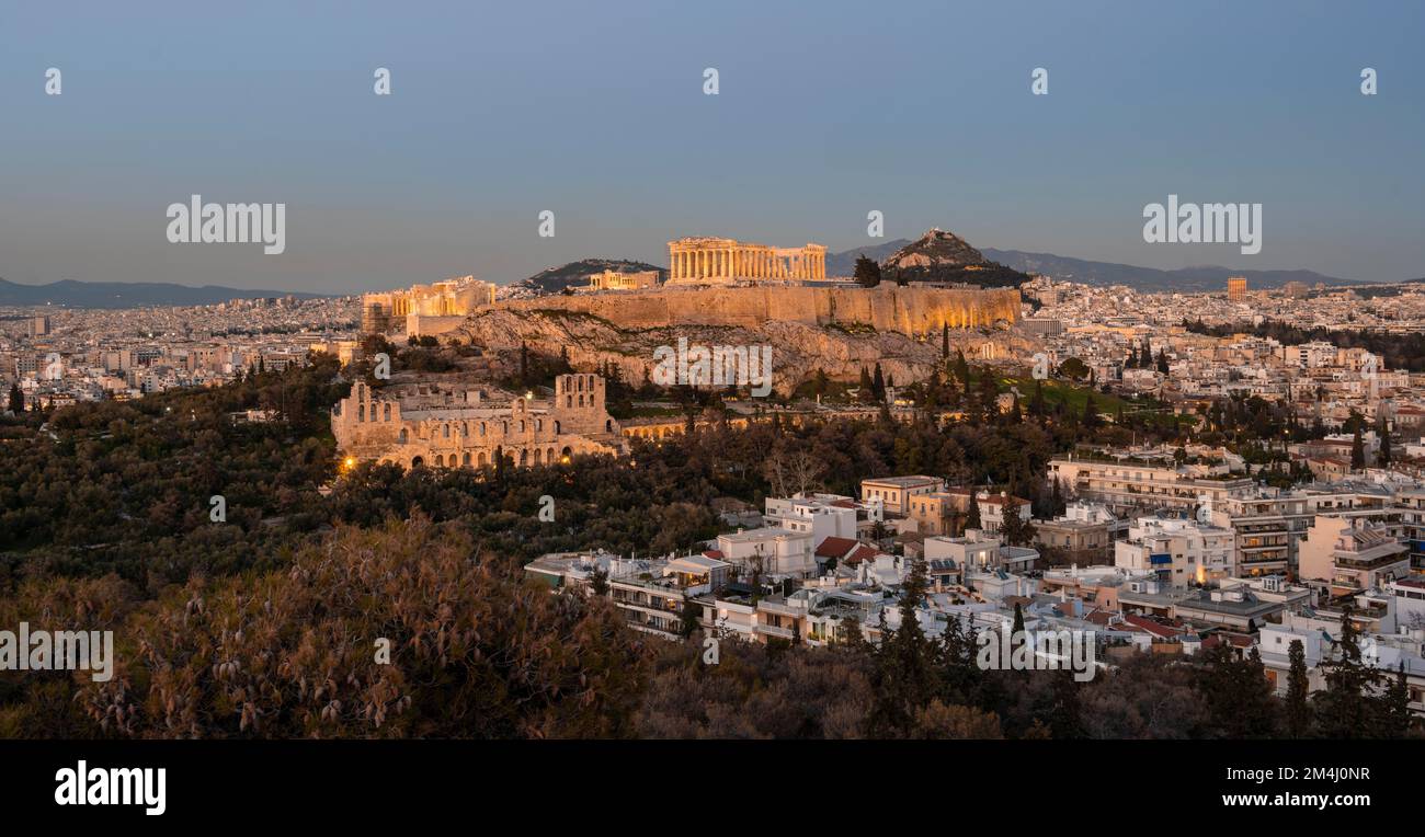 View from Philopappos Hill over the city at sunset, panorama of the illuminated Parthenon Temple ...