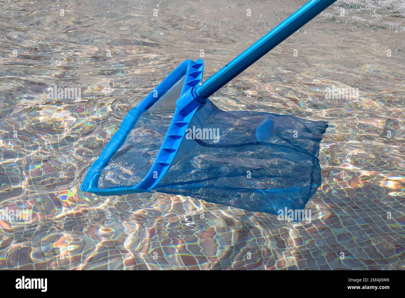 Mesh net for cleaning pool from debris. Cleaning pool, city fountain ...