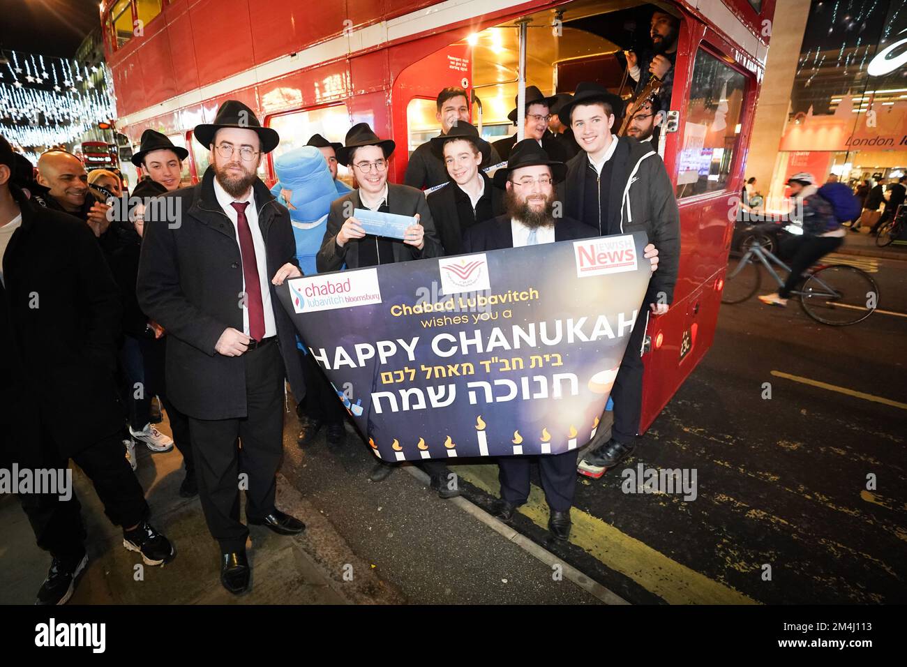 Members of the Jewish community next to a bus on Oxford Street in ...