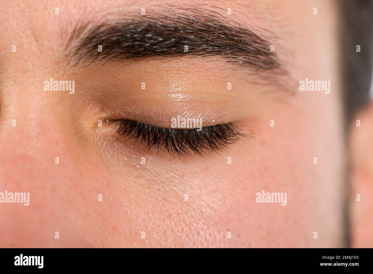 Lengthening and infolving treatment of male eyelashes, macro details of ...