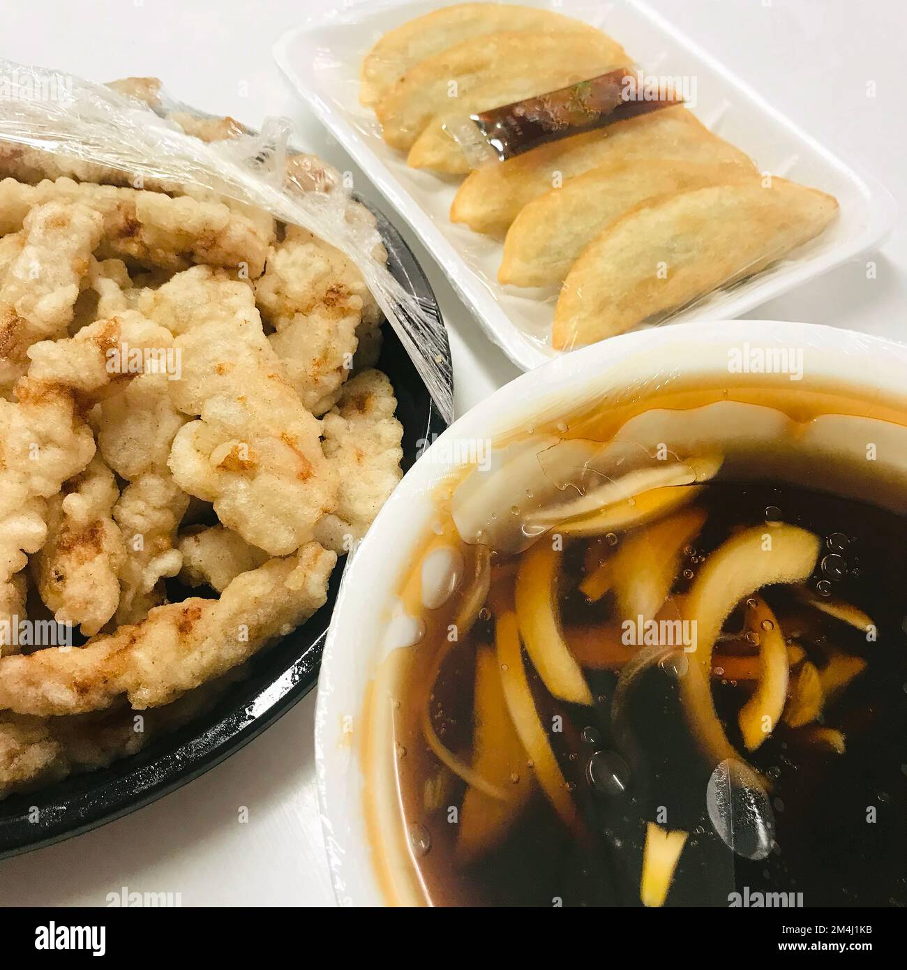 A set of Tangsuyuk(sweet and sour pork) with sauce and gun mandu(fried ...