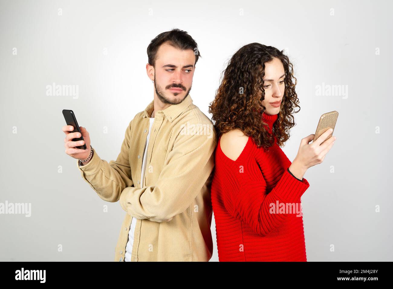 Pair of boyfriends who are reading messages on your smartphone. The ...