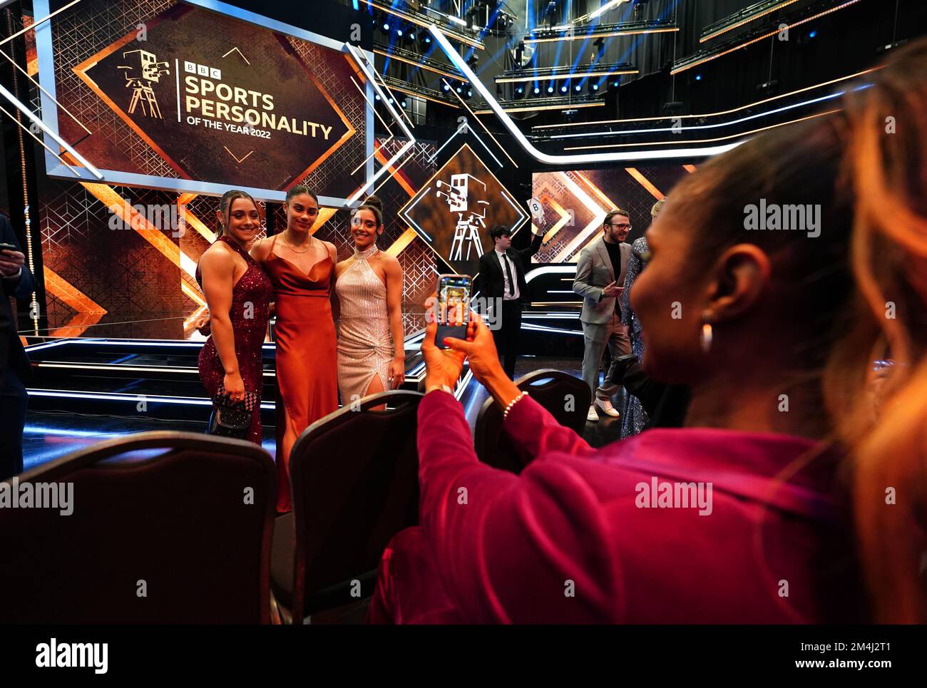 Denise Lewis takes a photo of Jennifer (left) and Jessica Gadirova ...