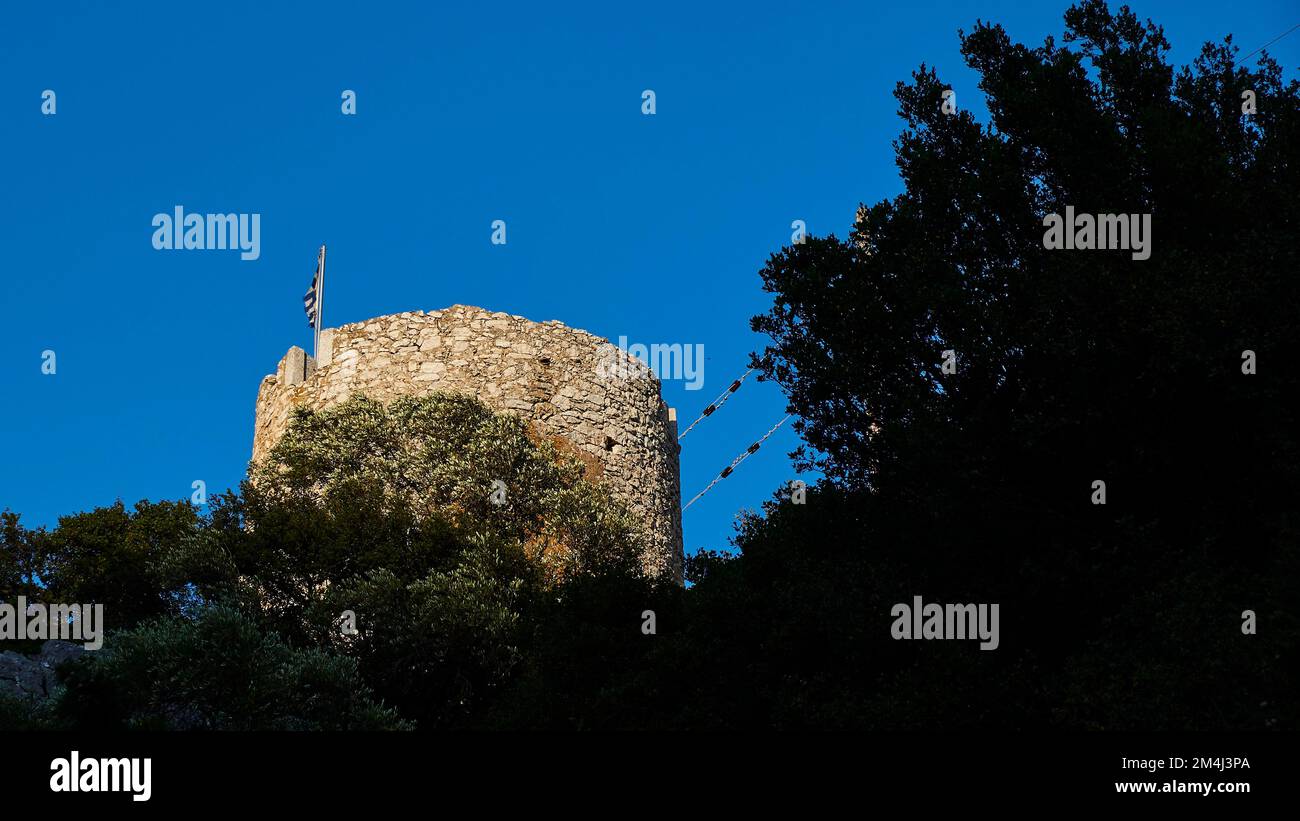 Round fortified defence tower, blue cloudless sky, Stavros, Ithaca ...