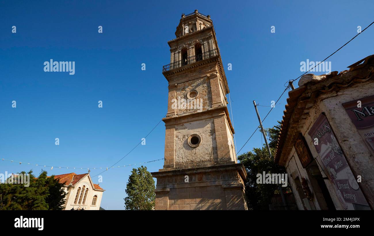 Village of Kiliomenos, square church tower, hexagonal spire, blue ...