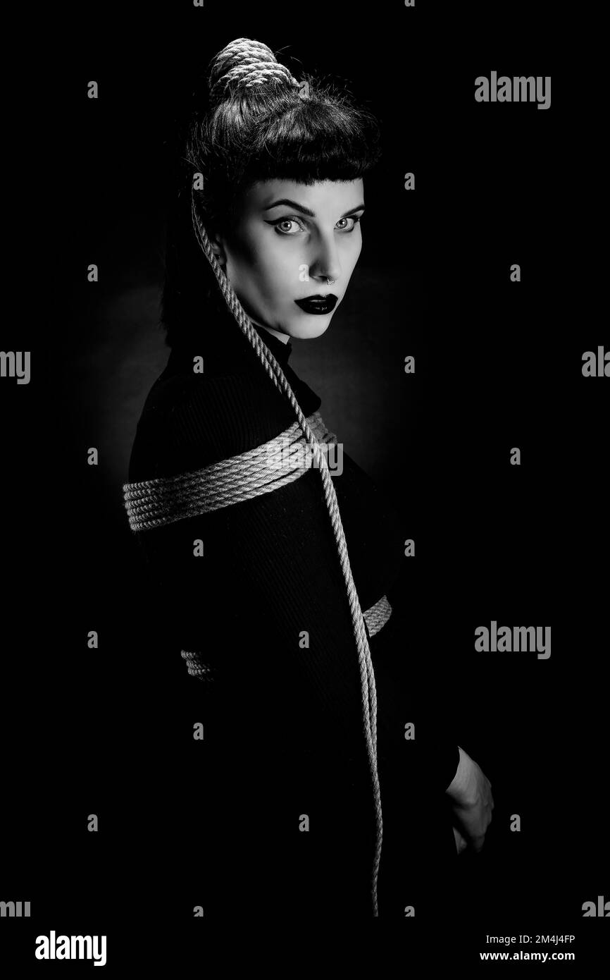 Bondage, bound young woman, woman with ropes, restraint, BDSM, black ...