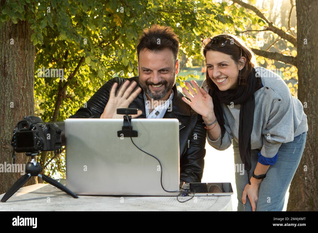 Couple of friends in front of the computer and camera, connected in ...