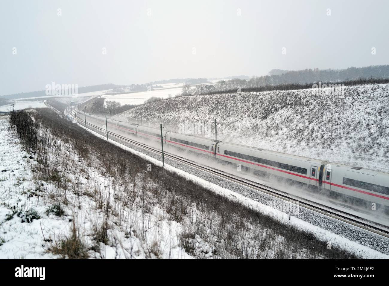 A Deutsche Bahn intercity train travelling across Bavaria in snowy ...