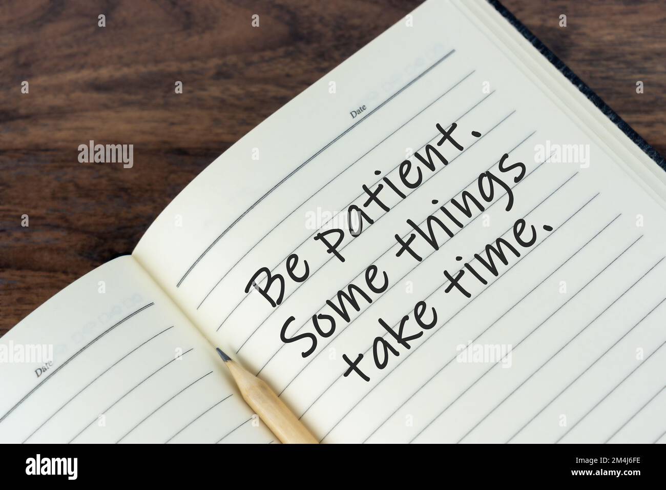 Inspirational quotes on note pad with text - Be patient, some things ...