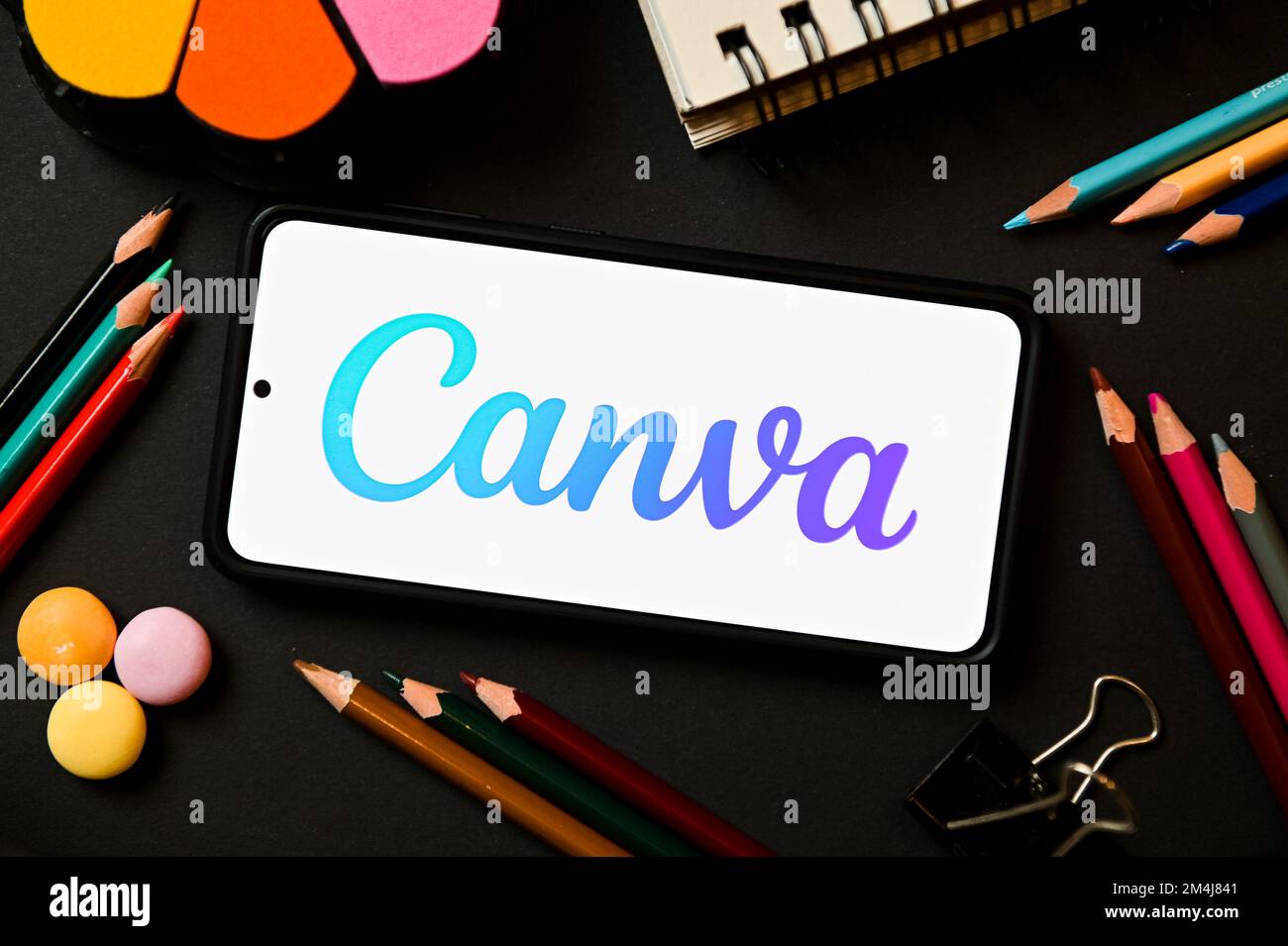 In this photo illustration a Canva logo seen displayed on a smartphone ...